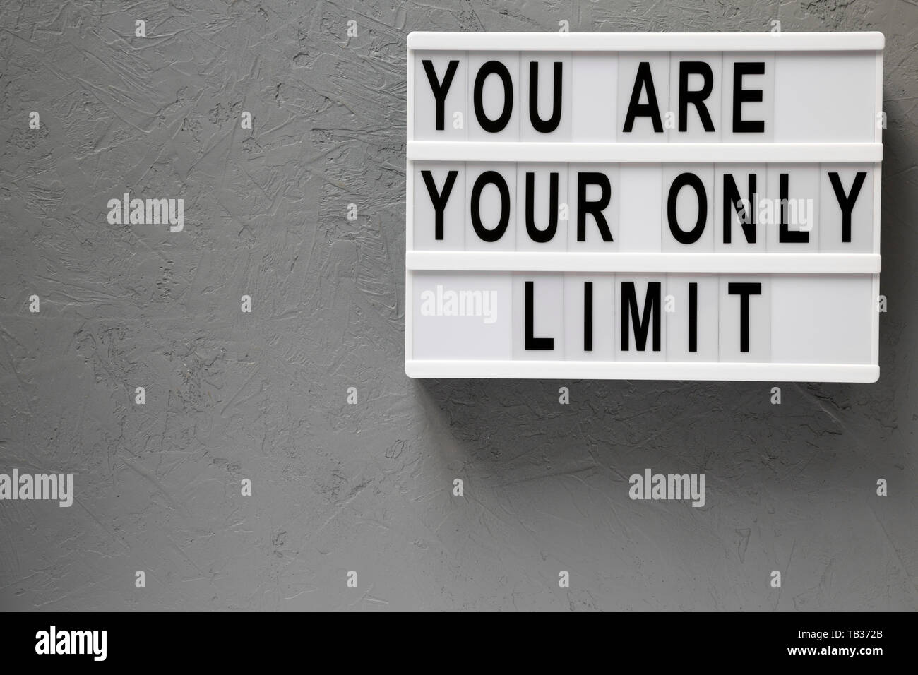 'You are your only limit' words on a modern board over gray background ...