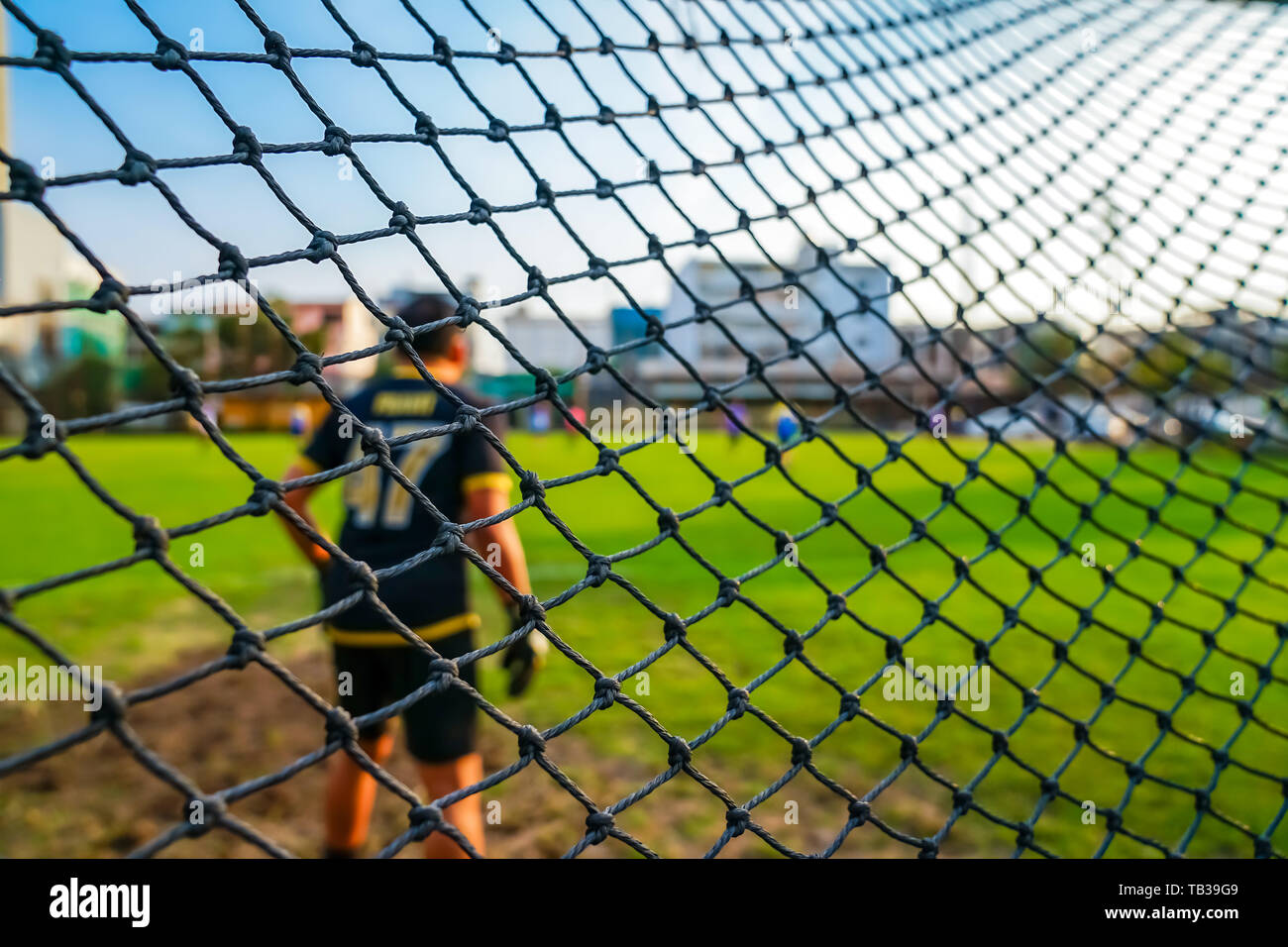 football goal net at the field with blur background Stock Photo - Alamy
