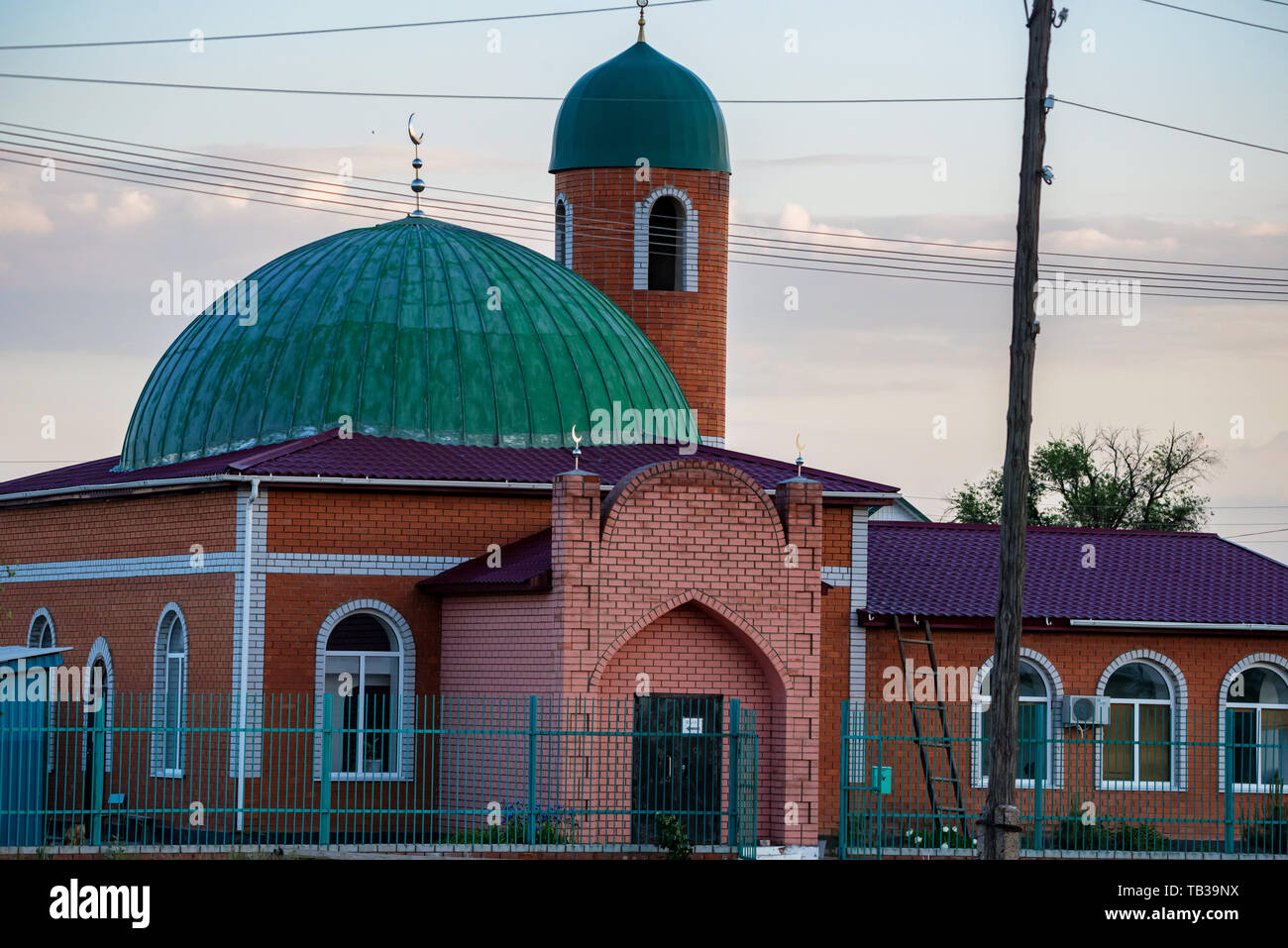 View of small red brick mosque in the country Stock Photo - Alamy
