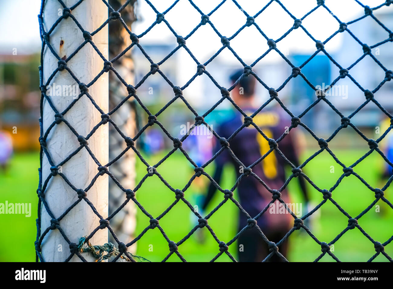 football goal net at the field with blur background Stock Photo - Alamy
