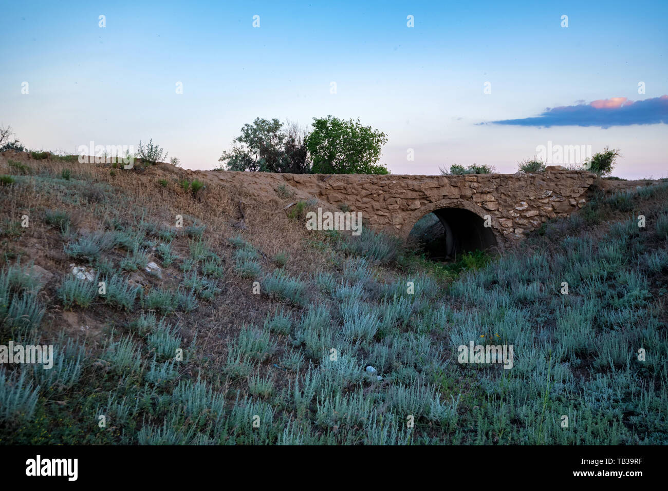 Small road arch bridge in the country Stock Photo - Alamy