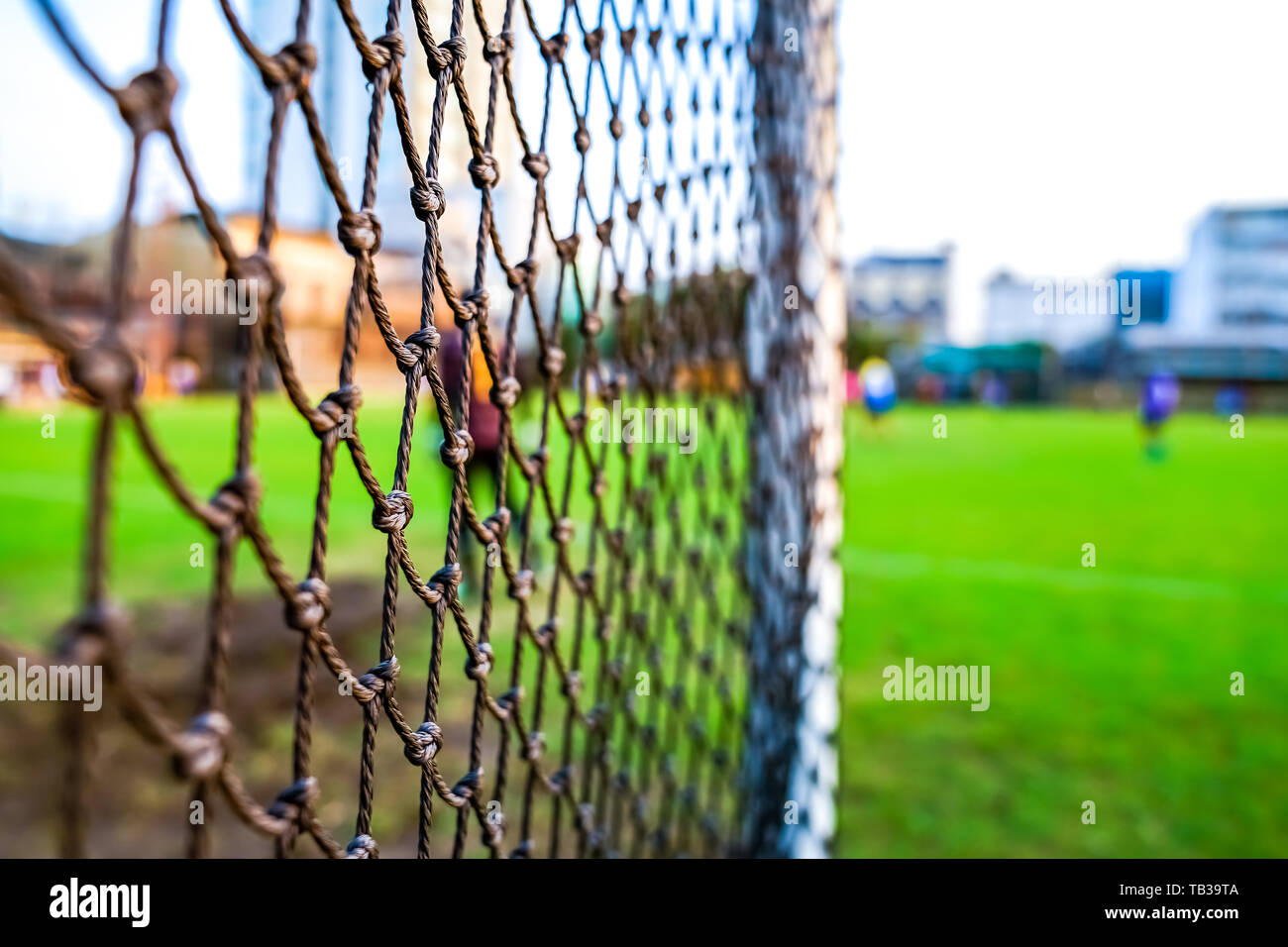 football goal net at the field with blur background Stock Photo - Alamy