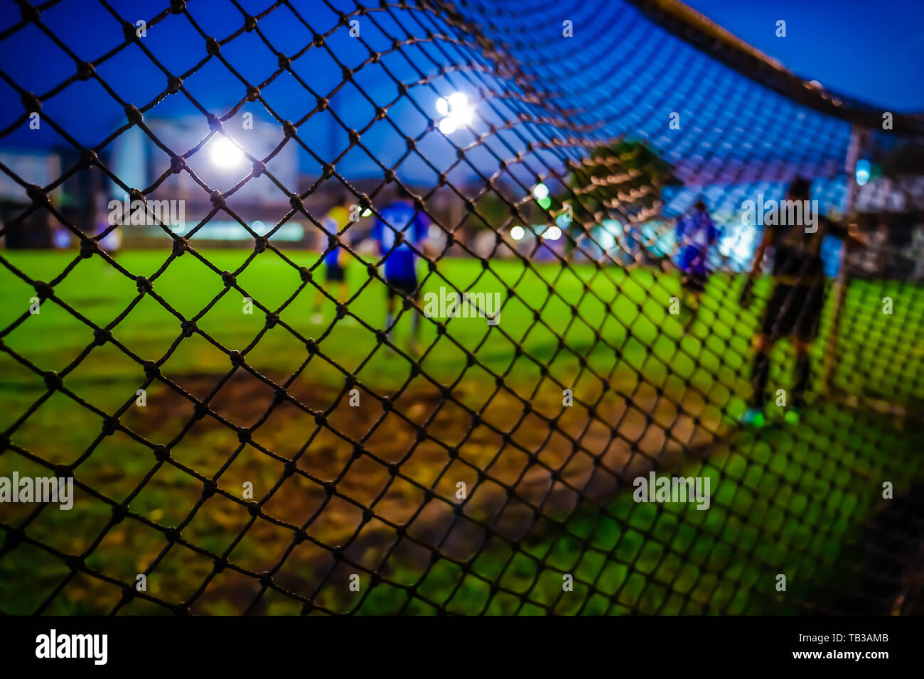football goal net at the field with blur background Stock Photo - Alamy