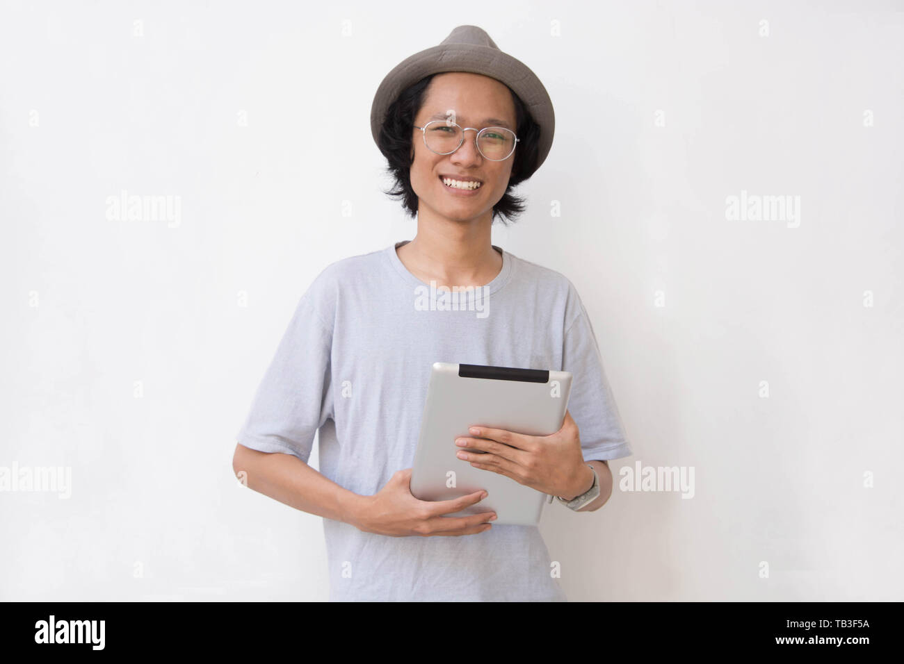 Smiling young japanese man using hi-res stock photography and images ...