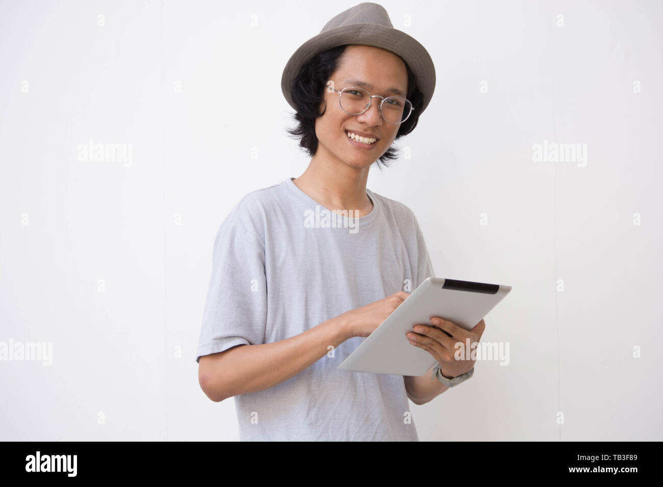 Young asian man fedora hi-res stock photography and images - Alamy