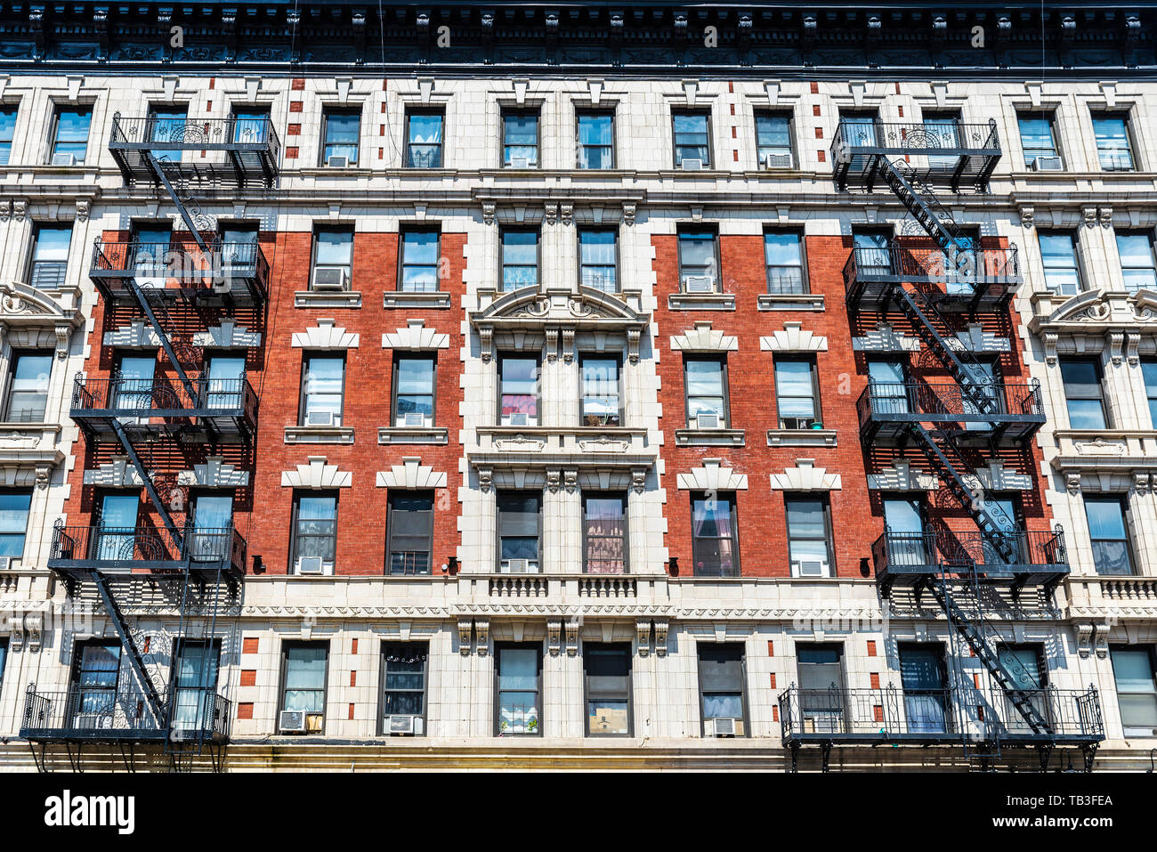 Old typical apartment buildings with its fire escape in the Harlem ...