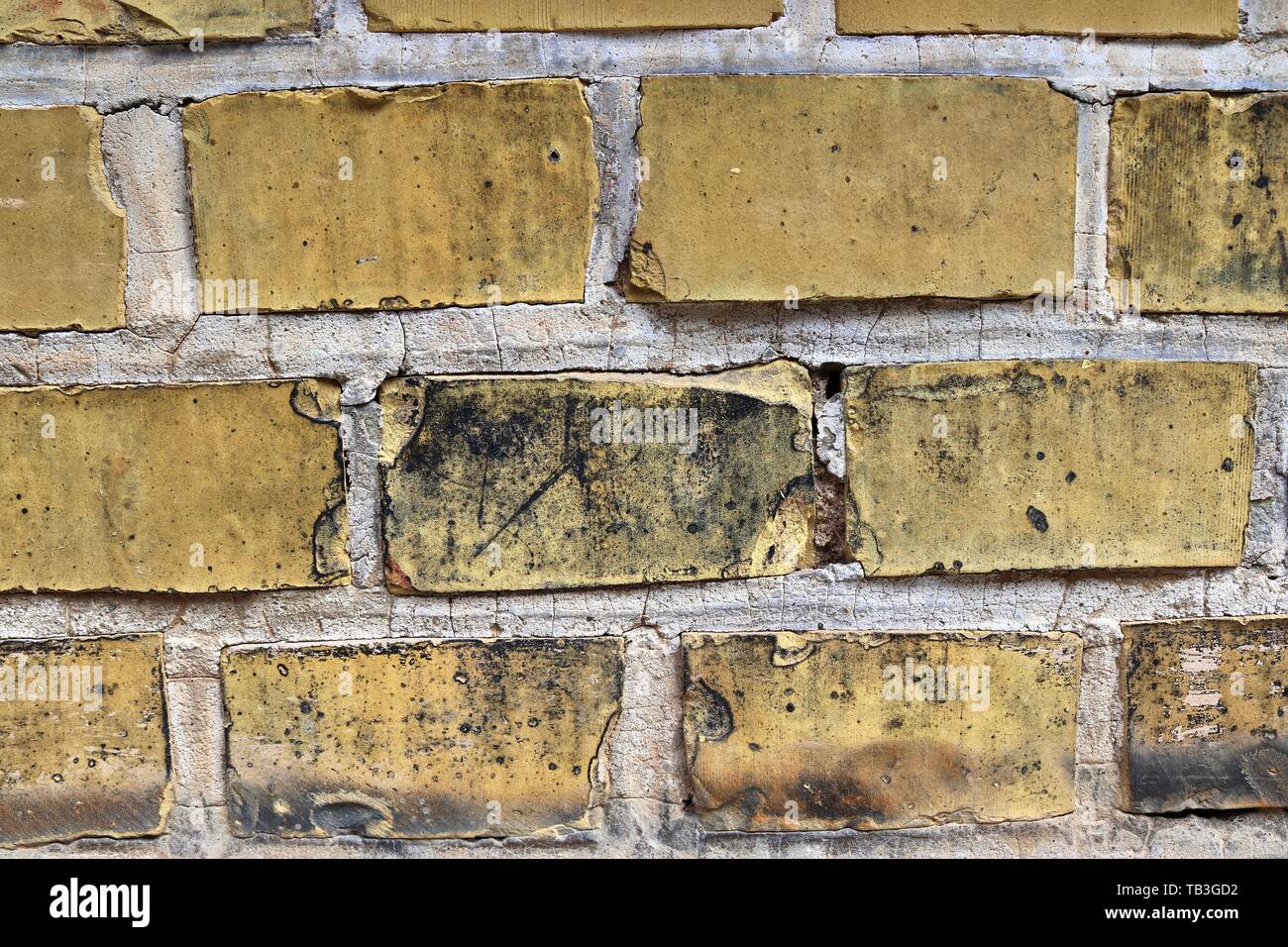 Close up view on colorful weathered and aged brick walls in high ...