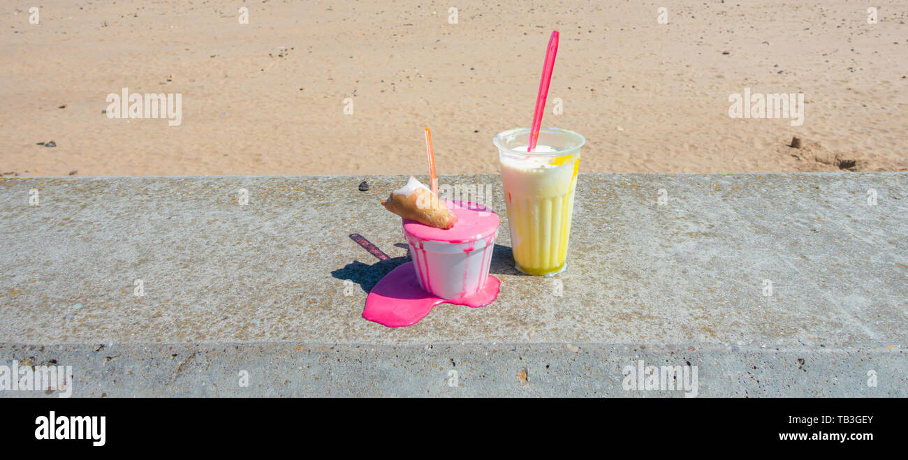 Melting ice cream on sea walloverlooking beach. UK Stock Photo - Alamy