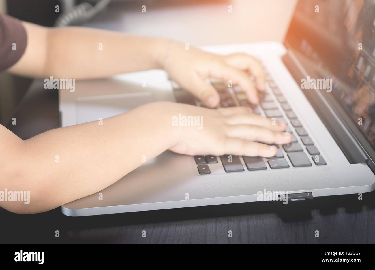 Child hand is working on computer keyboard Stock Photo - Alamy