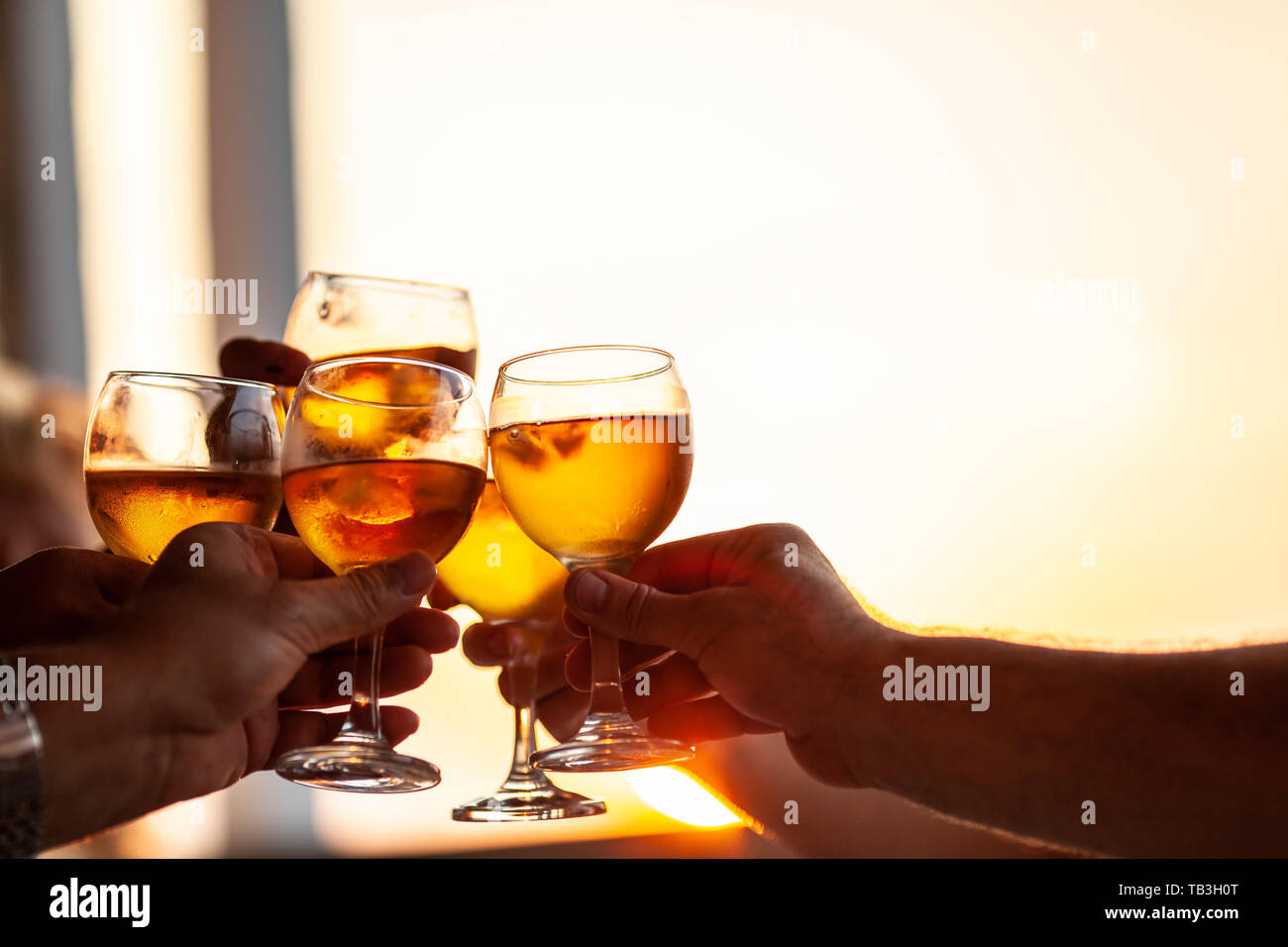 Friends toasting with wine at the party Stock Photo - Alamy