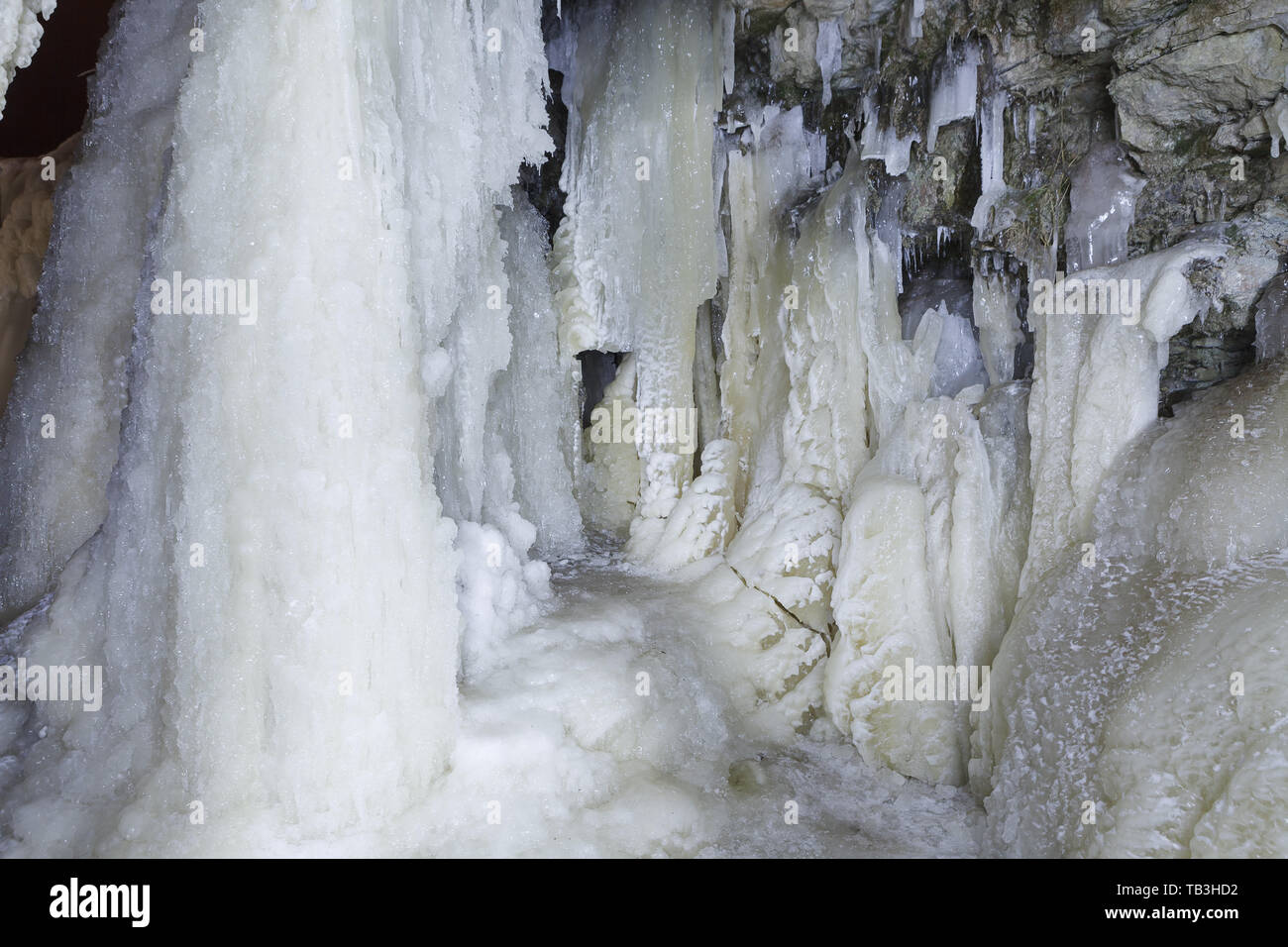 Frozen waterfall at night. Light painting illumination Stock Photo - Alamy