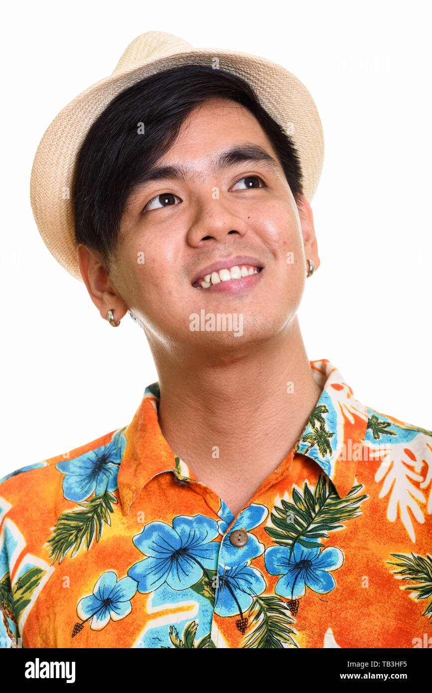 Face of young happy Asian man smiling while thinking Stock Photo - Alamy