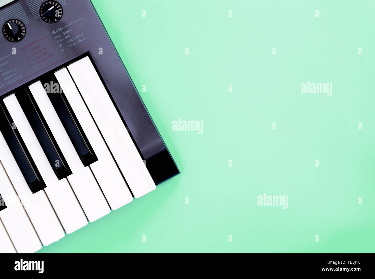 Music keyboard synthesizer instrument on teal copy space for Music ...