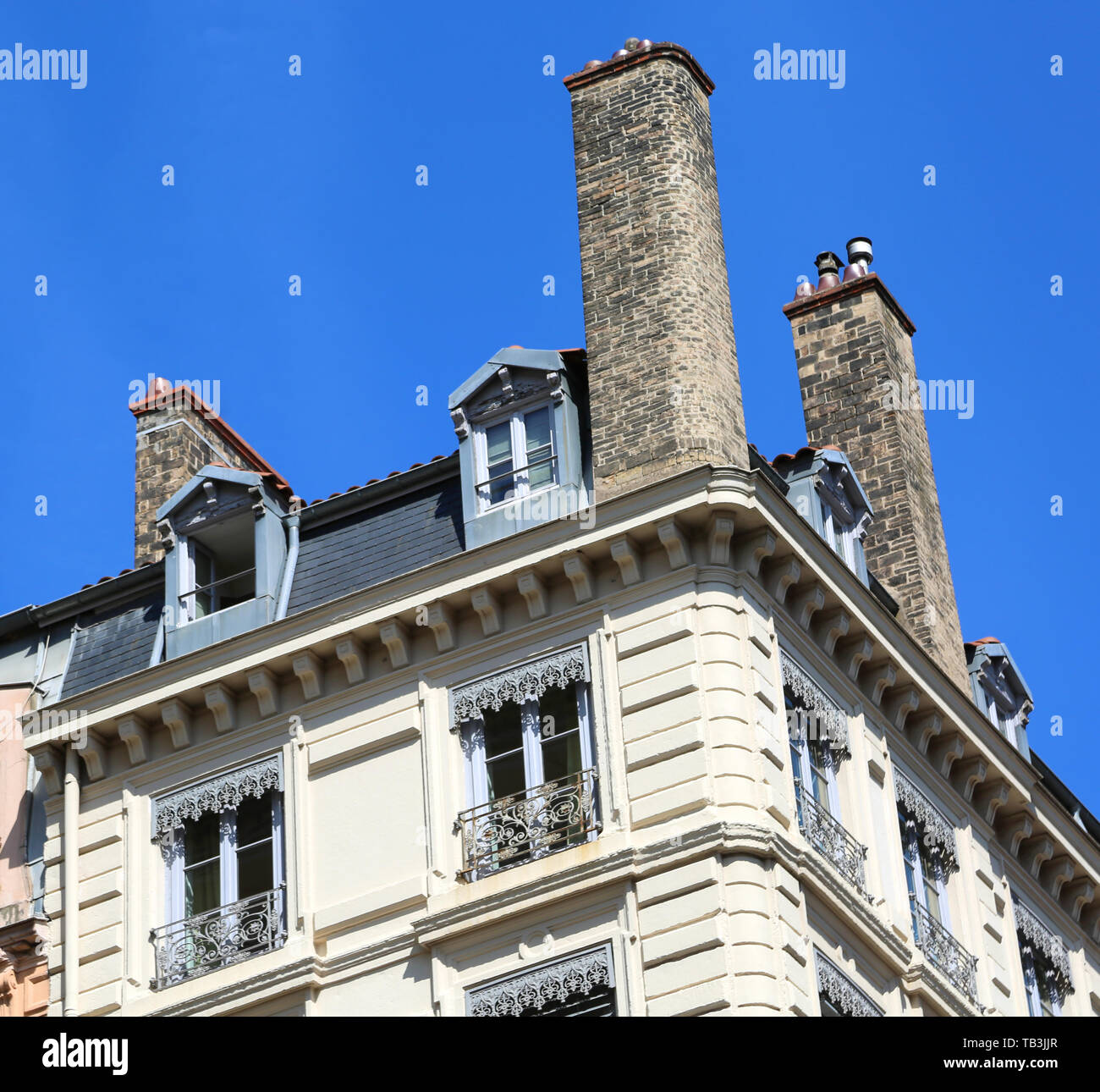 French style chimneys above the roof of the European houses Stock Photo ...