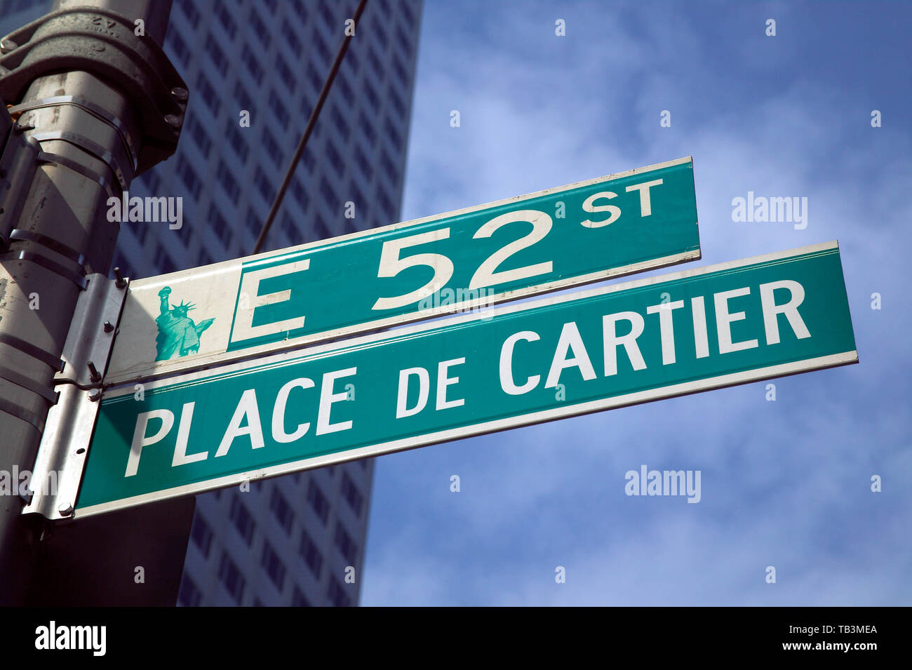 Place de Cartier sign on street sign post at corner of 52nd St and ...