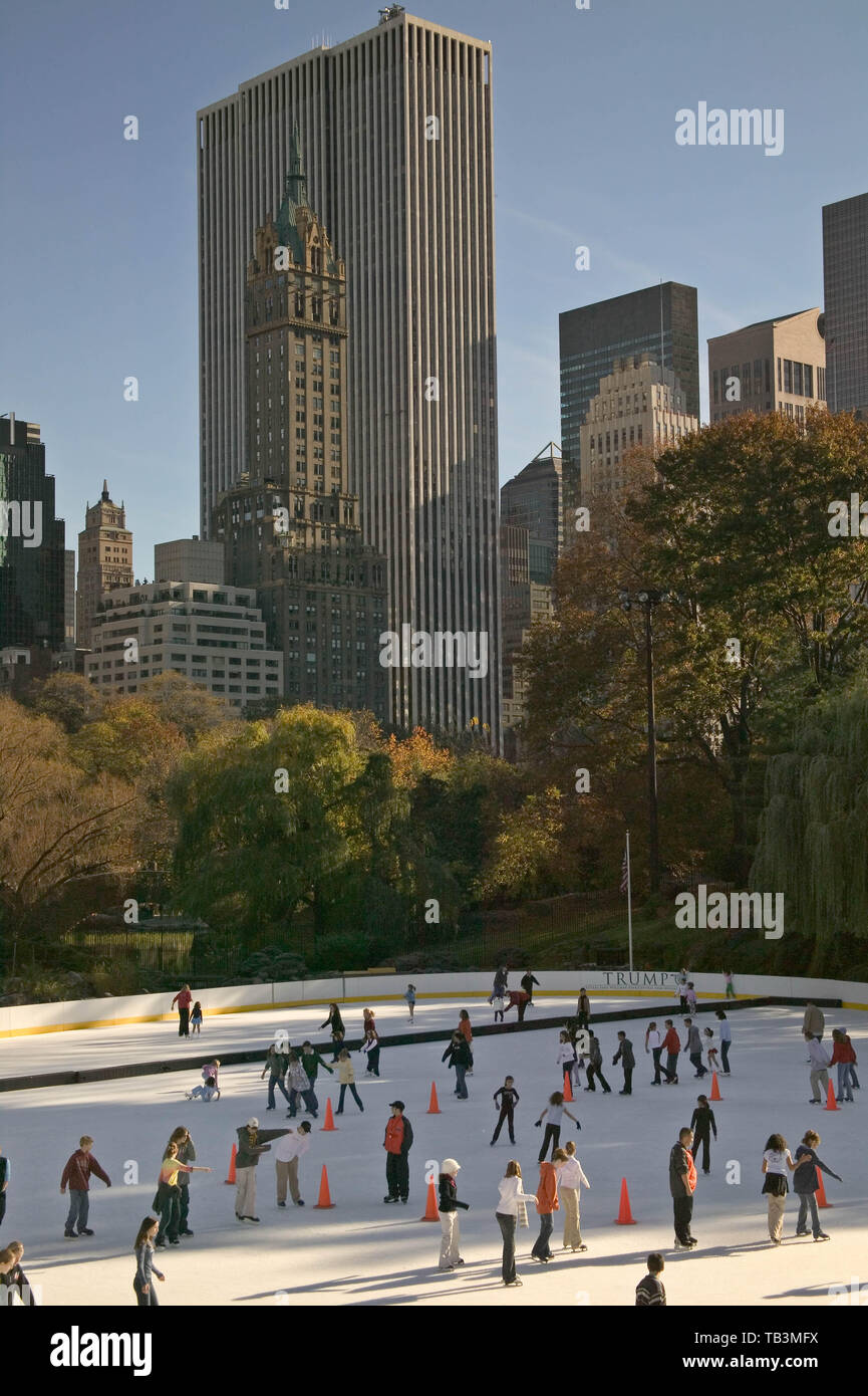 People ice skating at rink in Central Park with upper west side ...