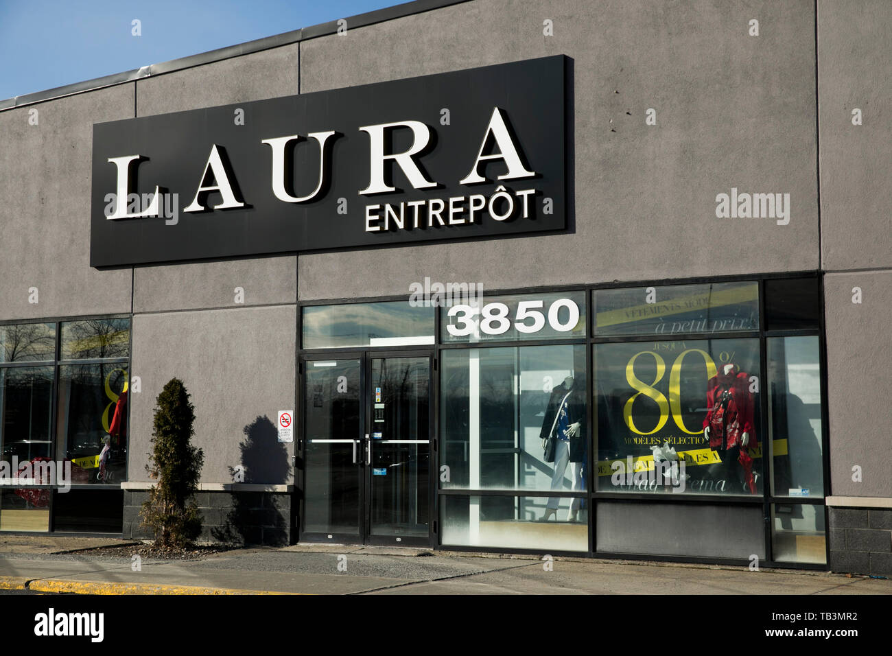 A logo sign outside of a Laura retail store location in Greenfield Park ...