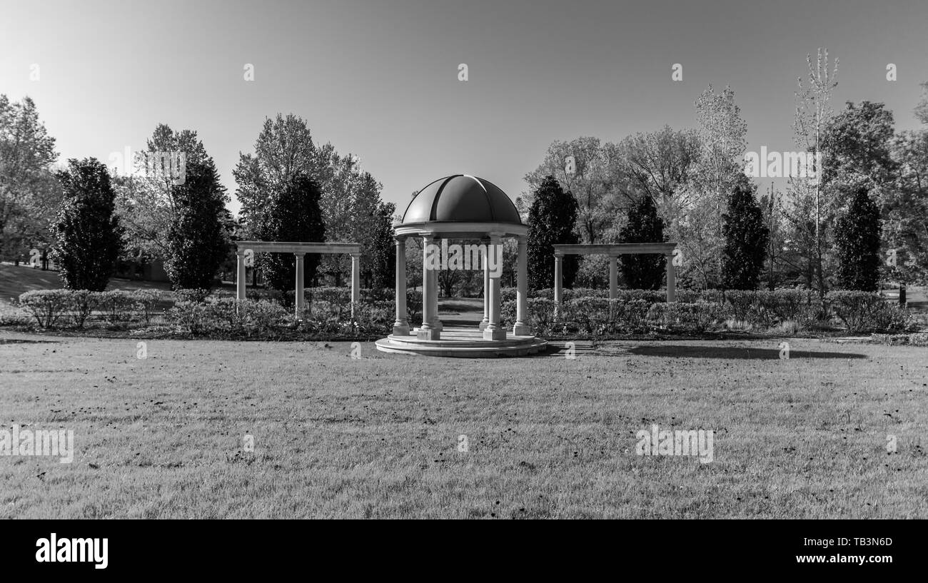 Garden featuring Arch with columns Stock Photo - Alamy