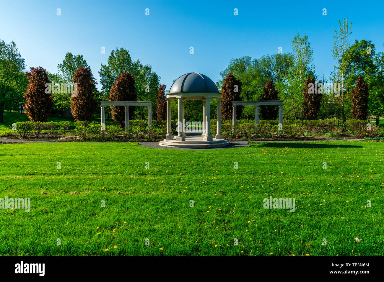 Garden featuring Arch with columns Stock Photo - Alamy