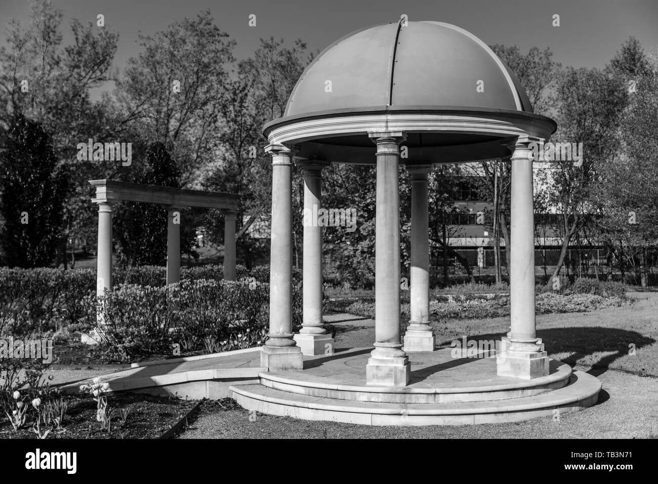 Garden featuring Arch with columns Stock Photo - Alamy