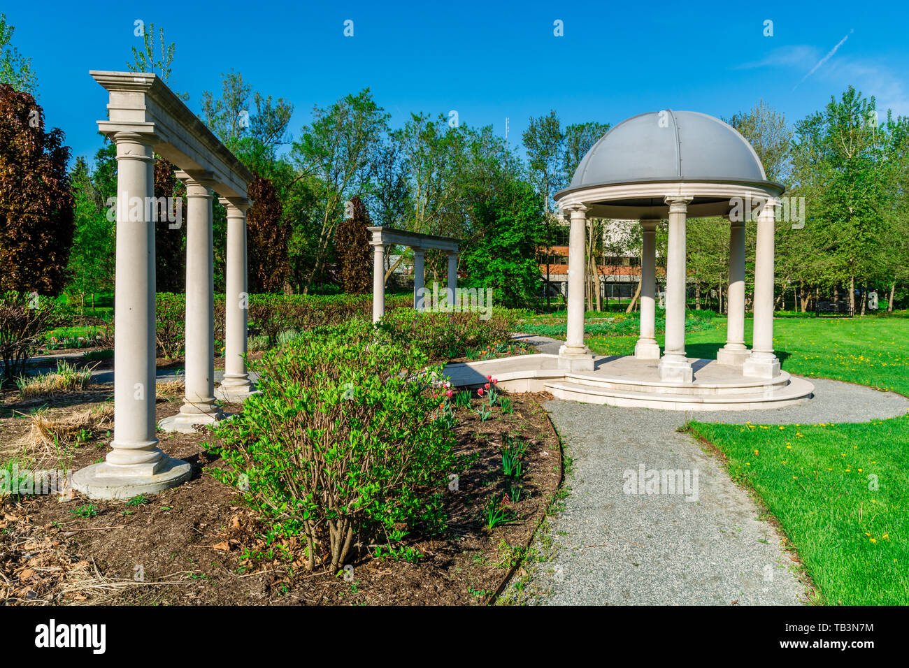 Garden featuring Arch with columns Stock Photo - Alamy