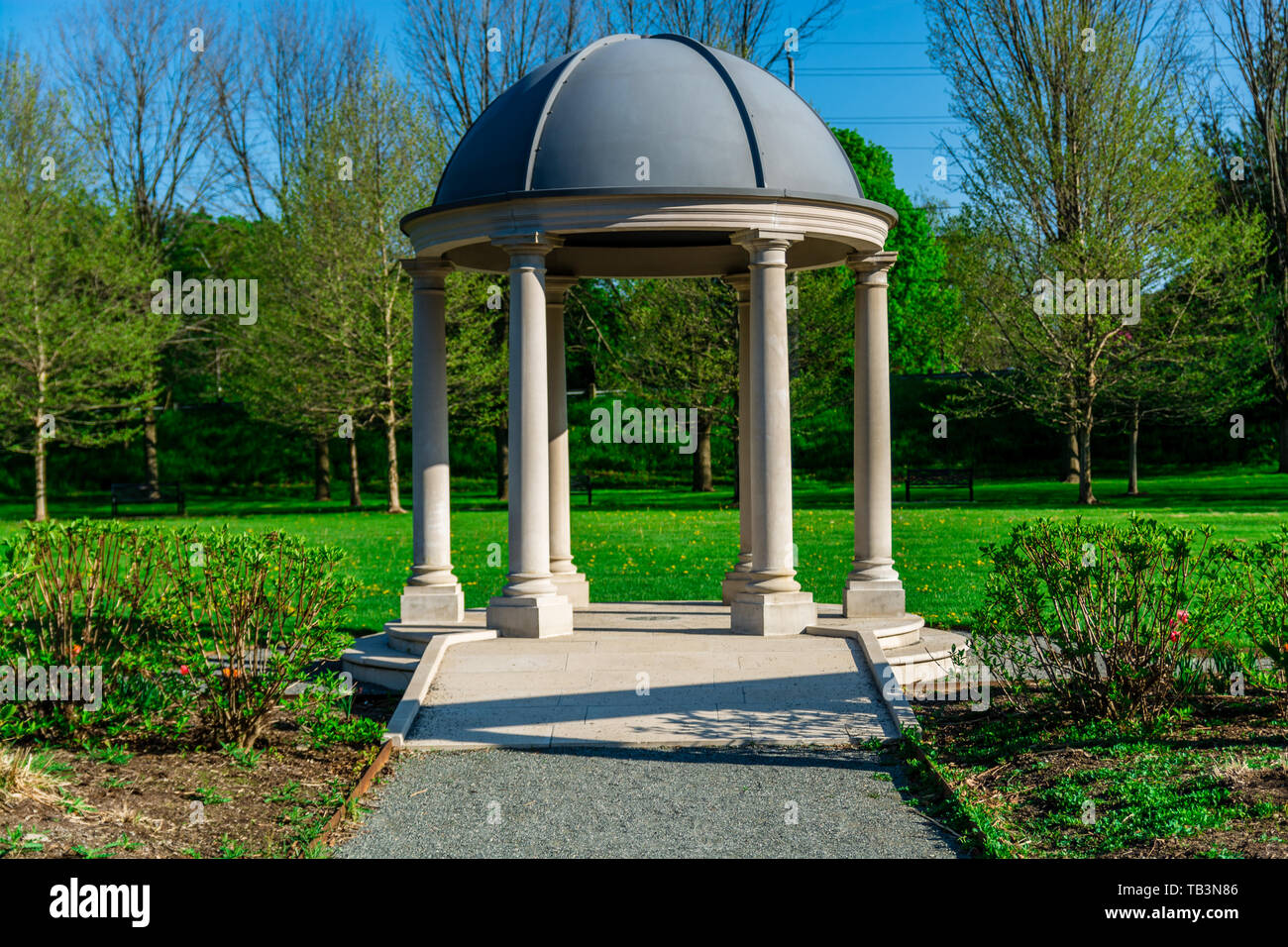 Garden featuring Arch with columns Stock Photo - Alamy
