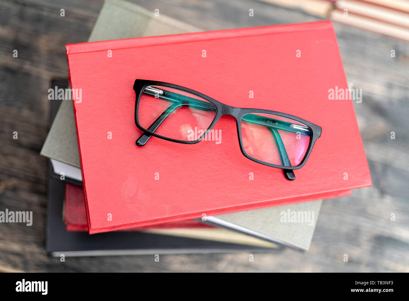 Glasses on the background of books. Symbol of knowledge, science, study ...