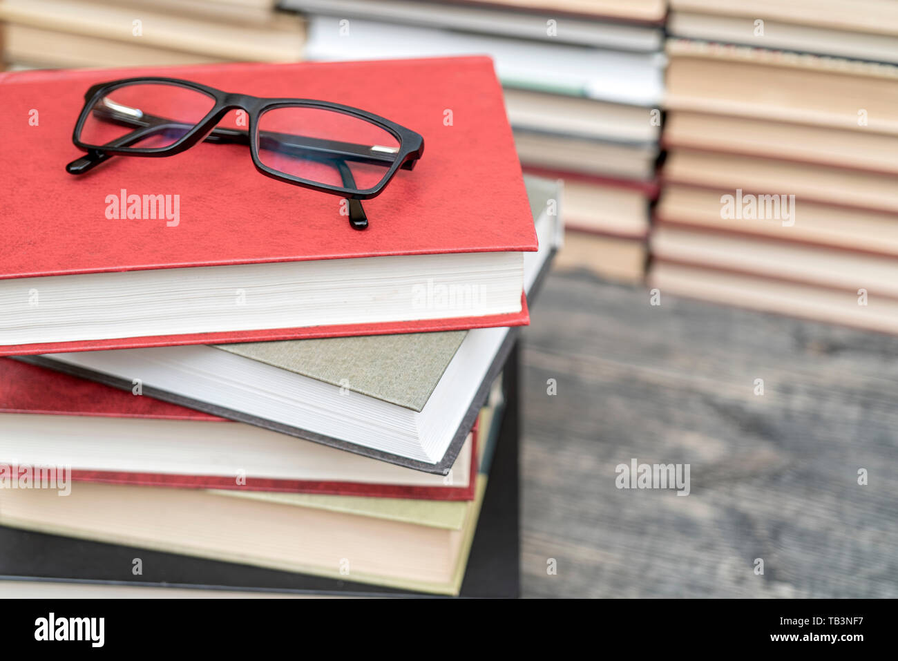Glasses on the background of books. Symbol of knowledge, science, study ...