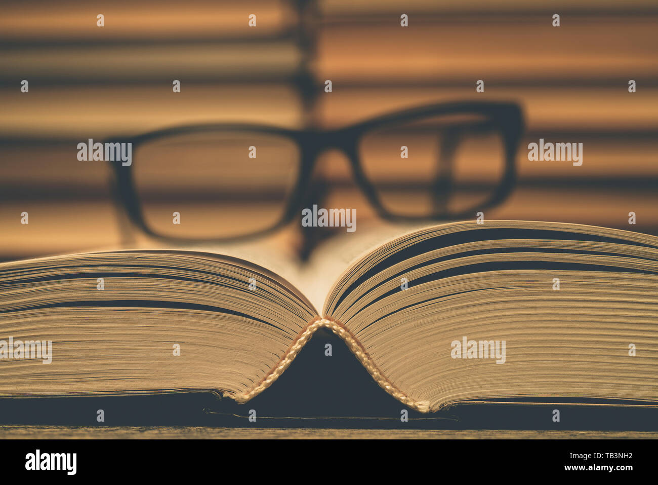 Glasses on the background of books. Symbol of knowledge, science, study ...