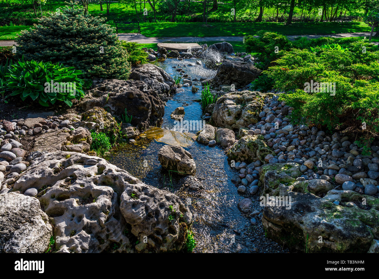 Garden showing water feature Stock Photo - Alamy