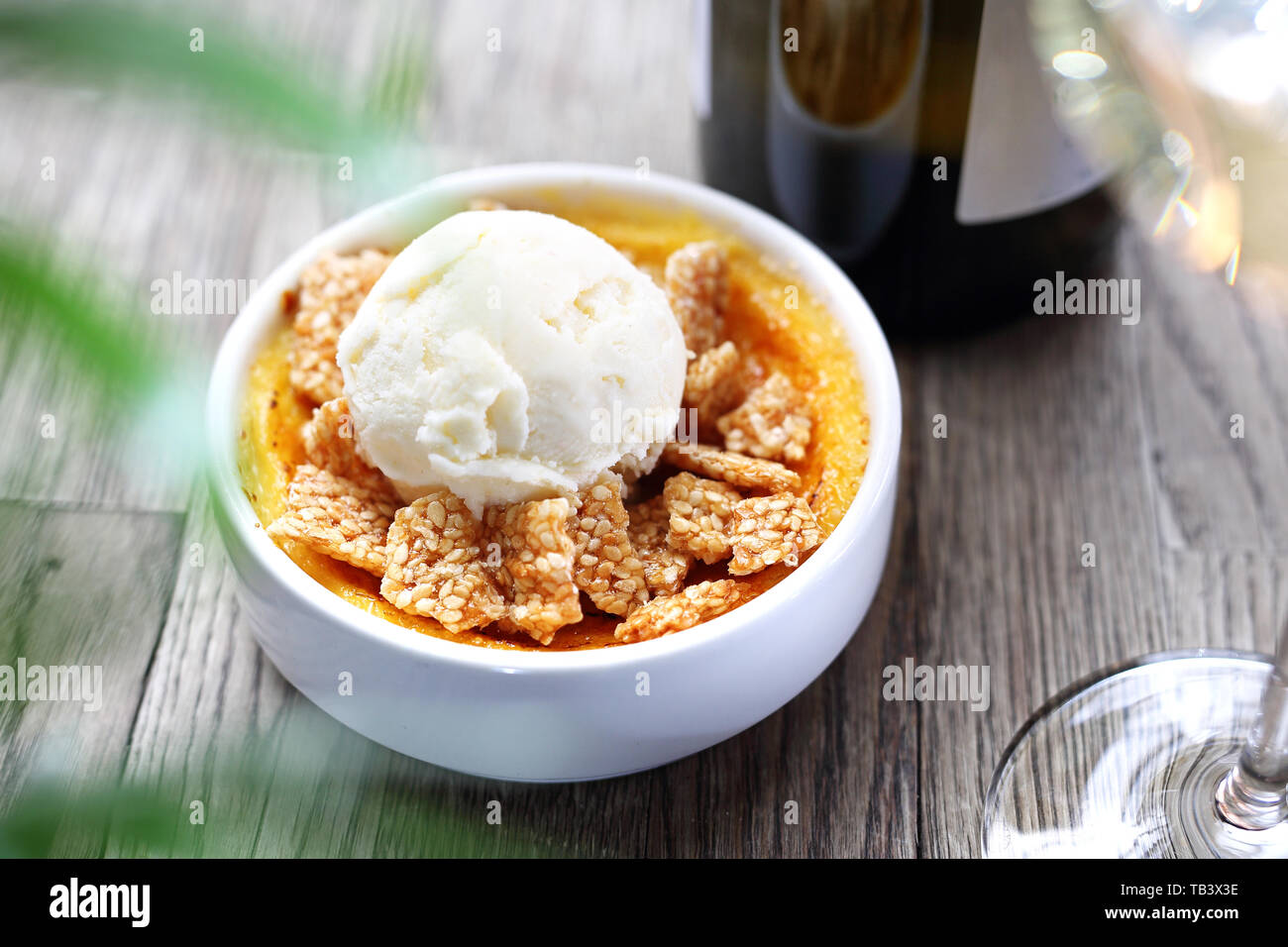 Dessert of cream brulee with ice cream and sesame in caramel Stock ...