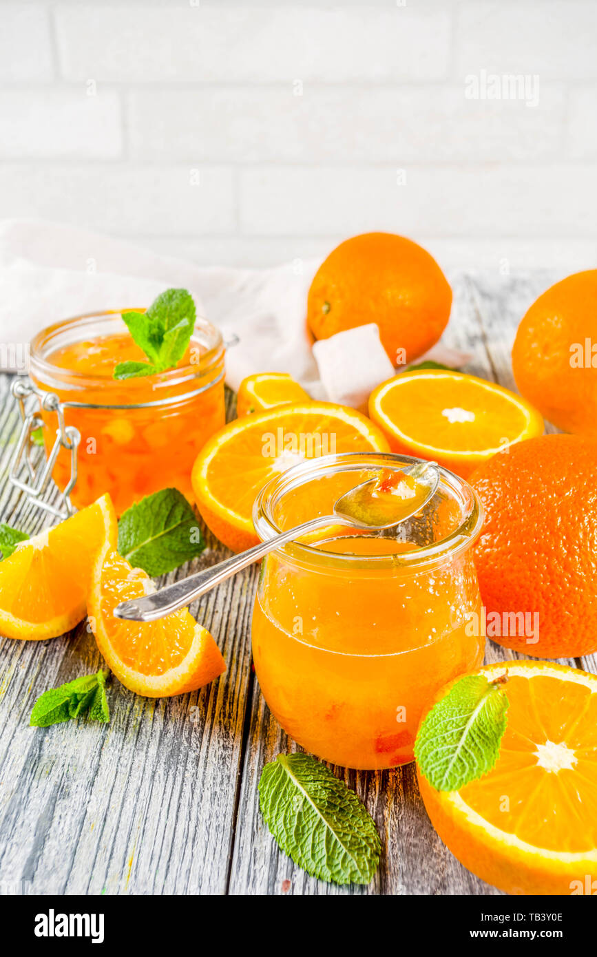 Homemade orange jam, with fresh sliced oranges and mint leaves, white ...