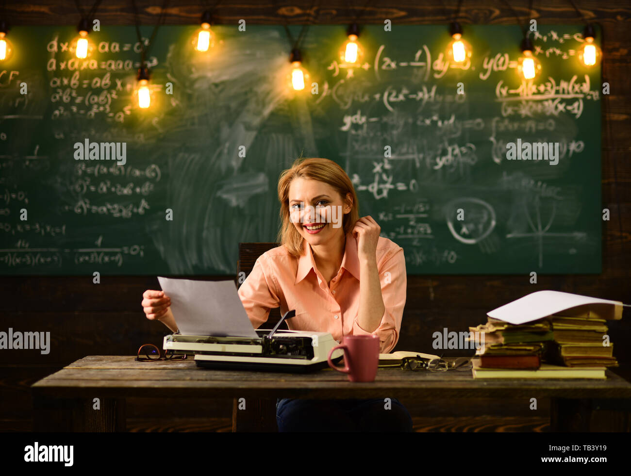author works on typewriter. author writes a novel or article for ...