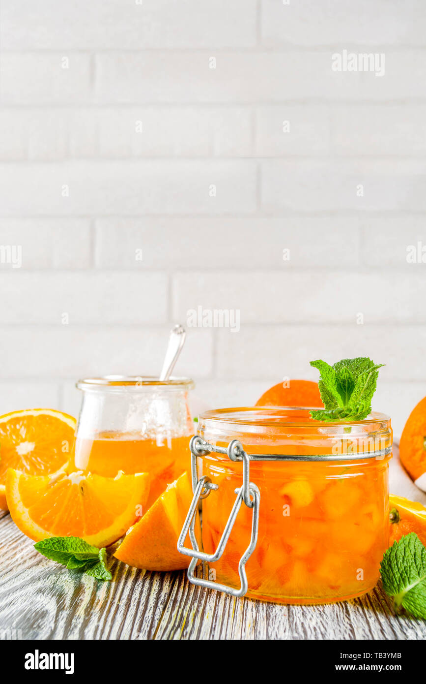 Homemade orange jam, with fresh sliced oranges and mint leaves, white ...