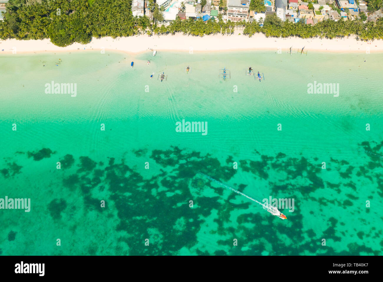 White sand beach and lagoon with turquoise water, aerial view. Coast of ...