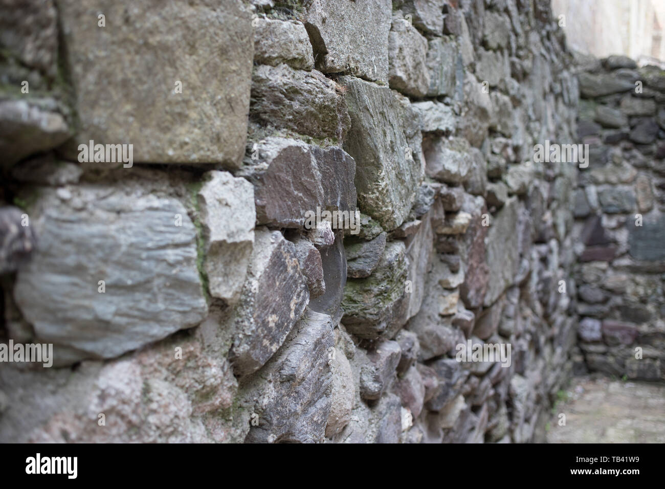Close up of various shaped stone wall of medieval fortress Stock Photo ...