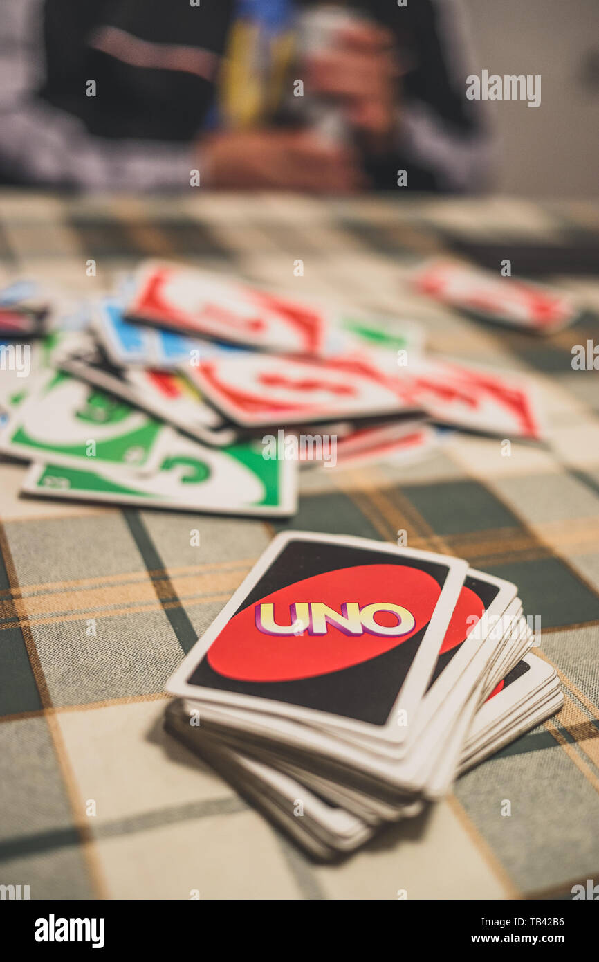 Uno cards toss on table in middle of game Stock Photo - Alamy