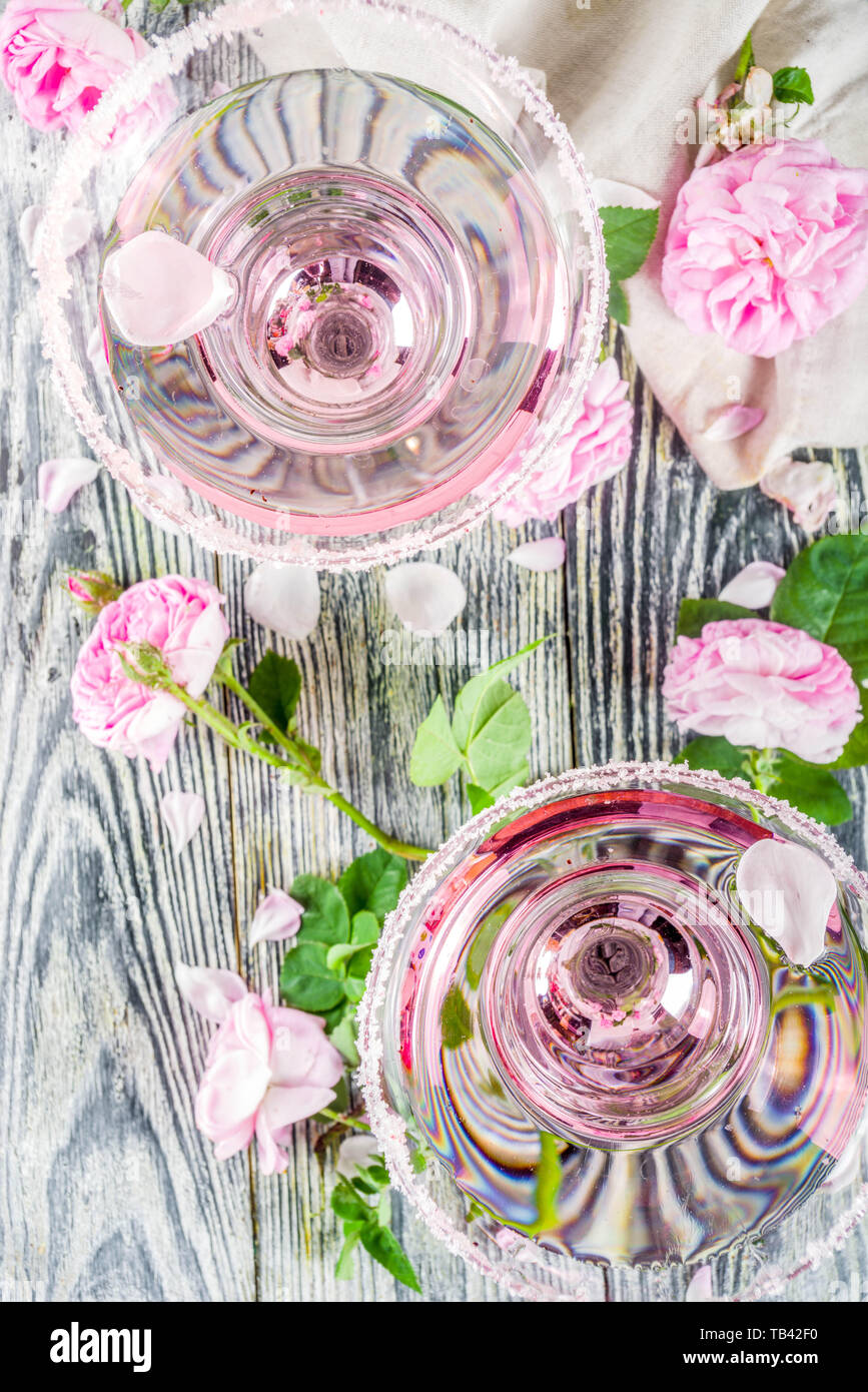 Trendy summer alcohol drink. Sweet rose cocktail Rice ‘n’ Roses. Pink ...