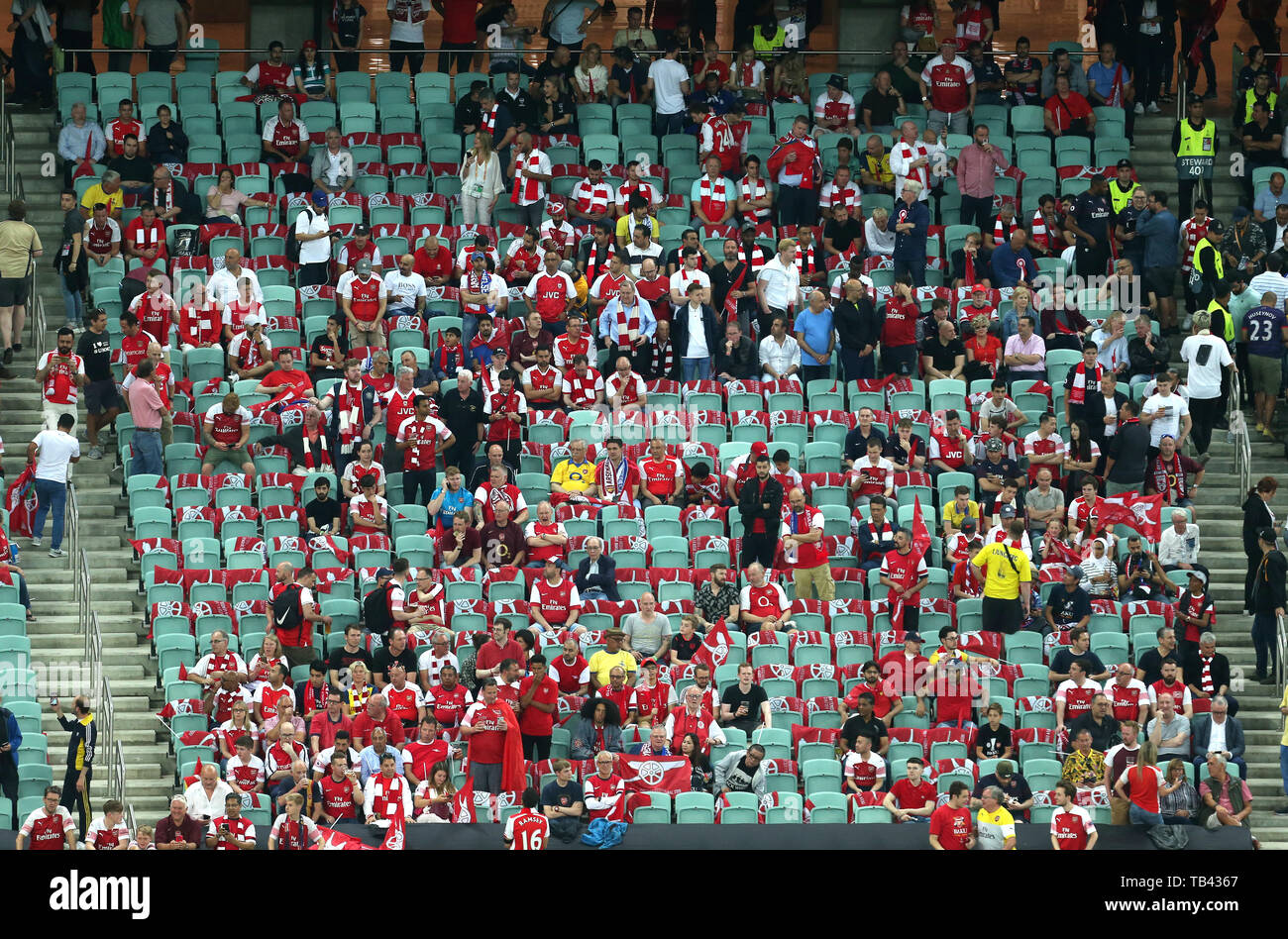 Arsenal fans in the stands with empty seats during the UEFA Europa ...