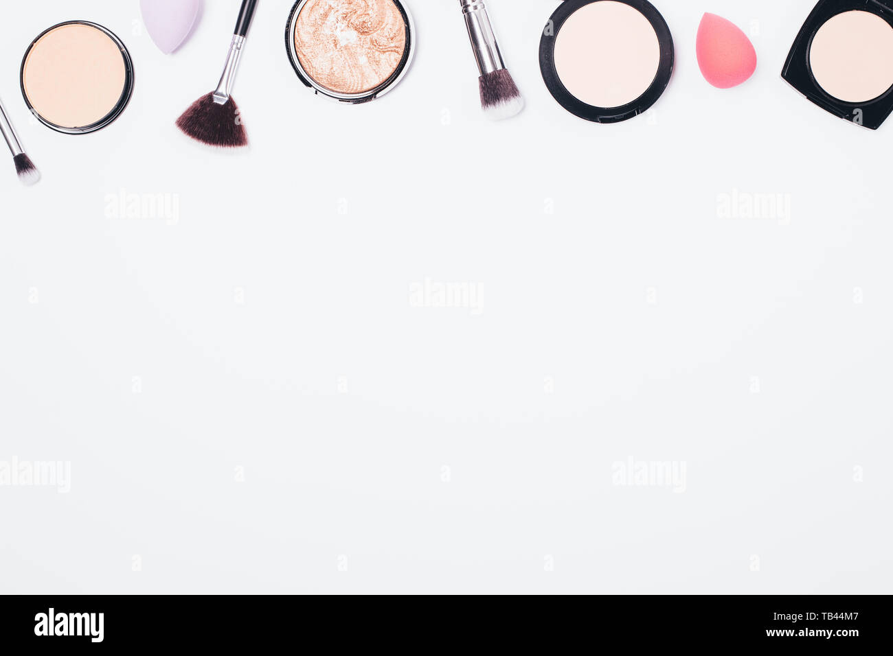 Flat lay border of decorative cosmetic products and accessories on ...