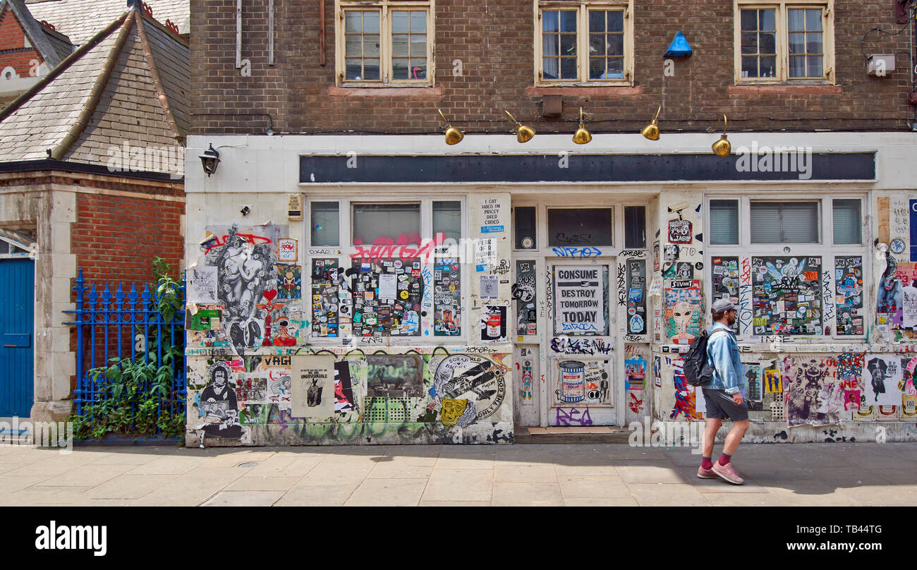 LONDON SPITALFIELDS BRICK LANE GAFFITI AND WALL ART WITH A PEDESTRIAN ...