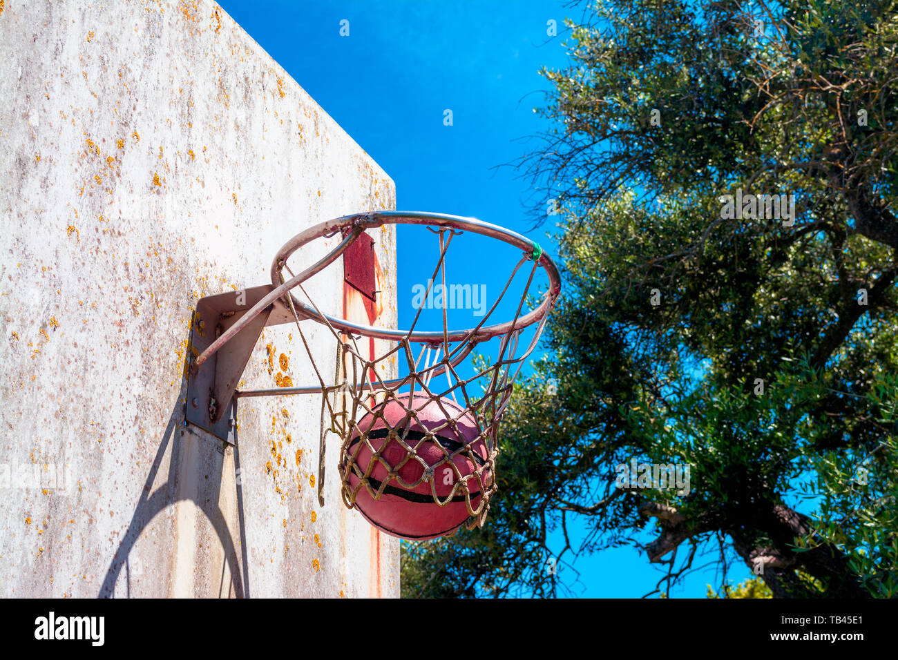 ball inside the basket in an old country playground Stock Photo - Alamy