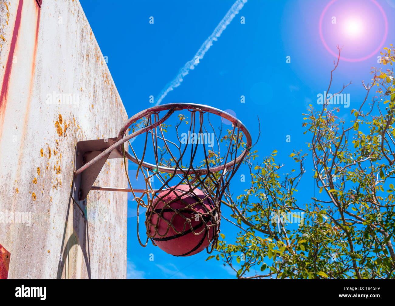 ball inside the basket in an old country playground Stock Photo - Alamy