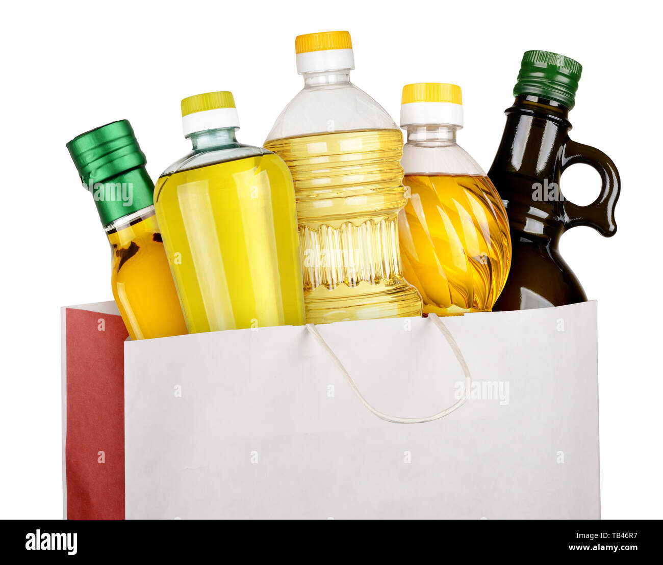 Oil bottles in paper bag isolated on white background Stock Photo - Alamy