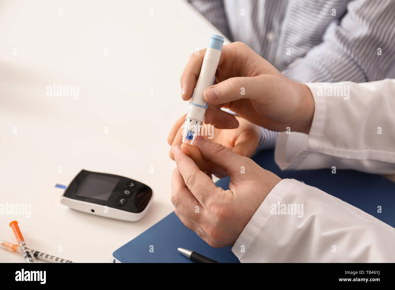 Doctor taking blood sample of diabetic patient in clinic, closeup Stock ...