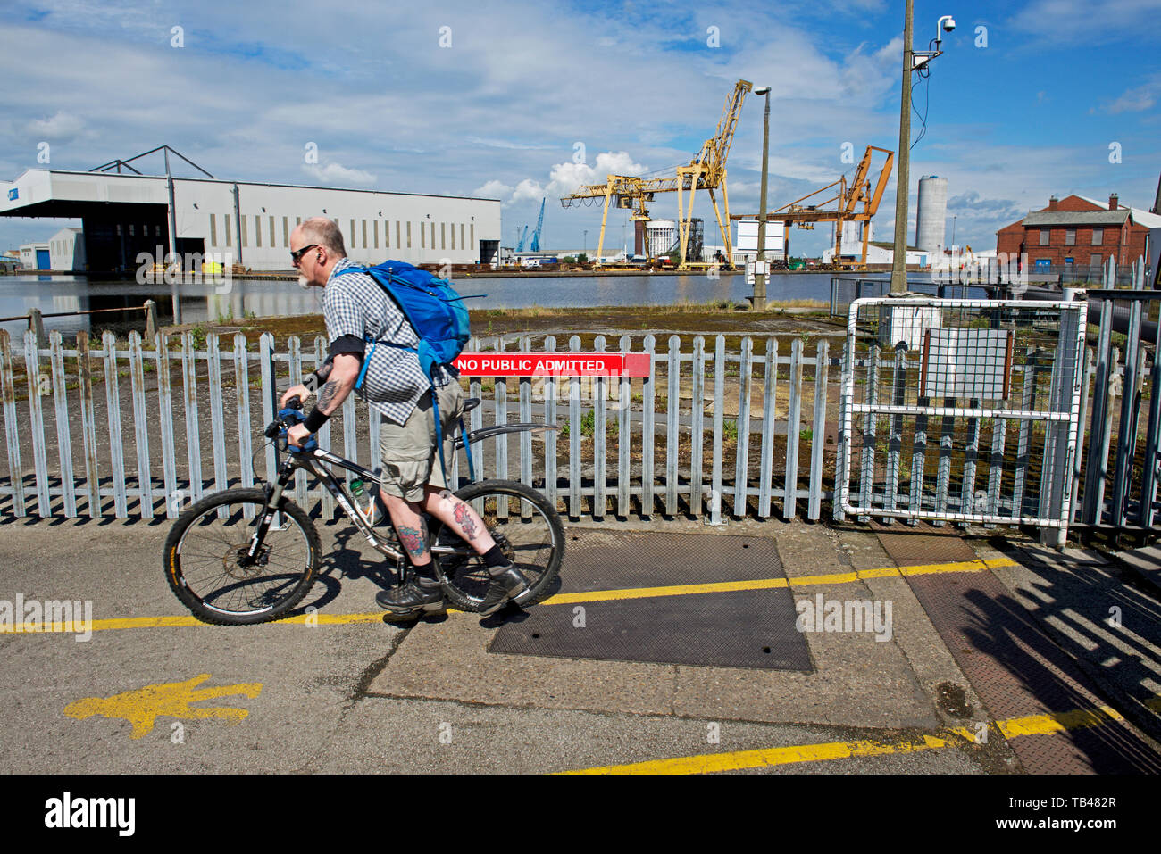 Man cycling past Goole Docks, East Yorkshire, England UK Stock Photo ...