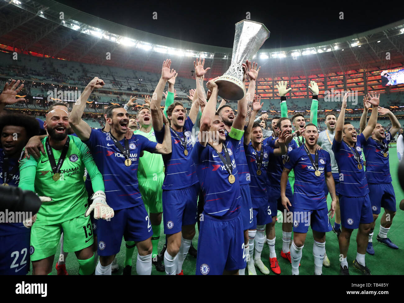 Chelsea's Cesar Azpilicueta celebrates with the trophy and team mates ...