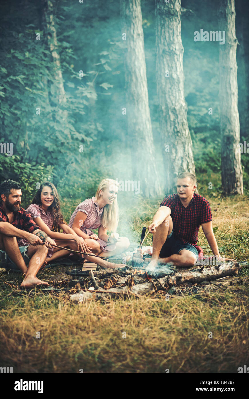 People Sitting Around Camp Fire High Resolution Stock Photography and ...