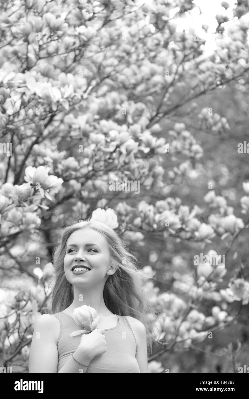 girl in beautiful magnolia flowers pink color tree Stock Photo - Alamy