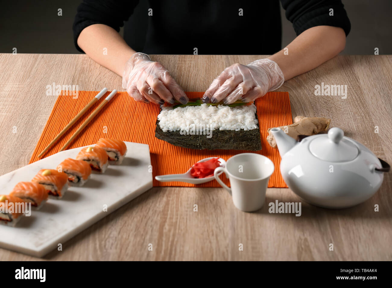 Young woman eating sushi rolls hi-res stock photography and images - Alamy